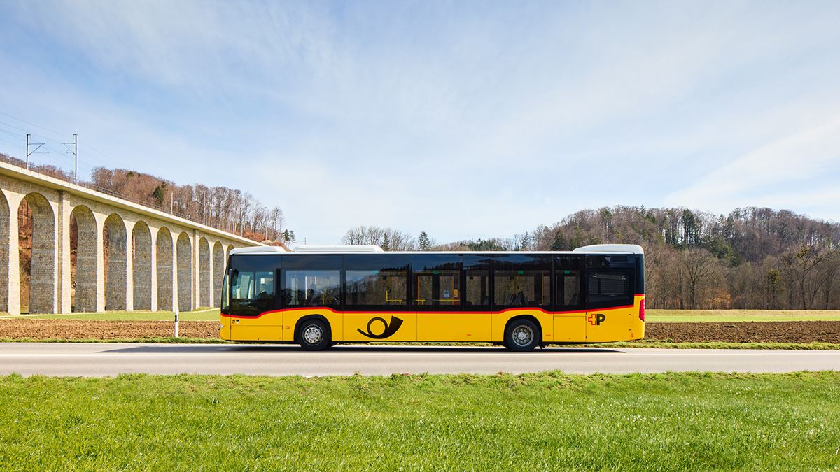 Common visual identity with modernized logo for Swiss Post and PostBus.